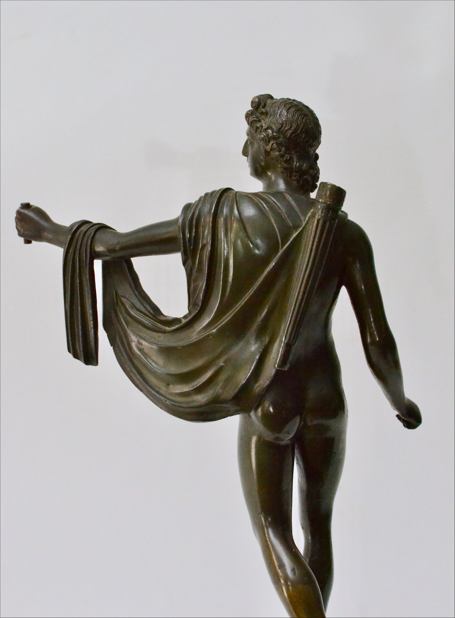 A Patinated Bronze Sculpture Of Apollo With An Ormolu Mounted Marble Base.